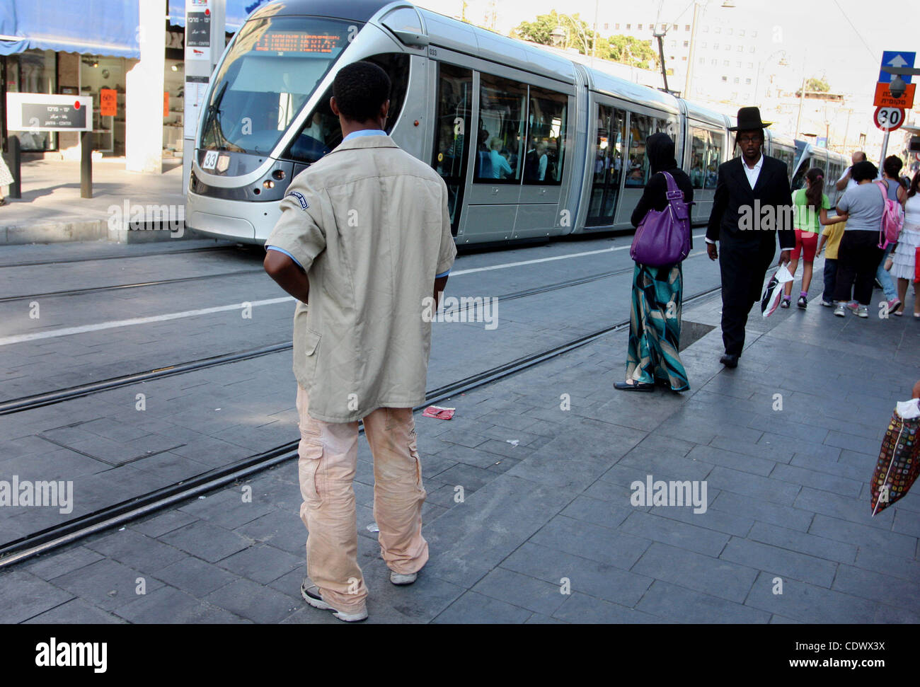 Palestinian and israeli Passengers ride a light rail train, Ten days ...