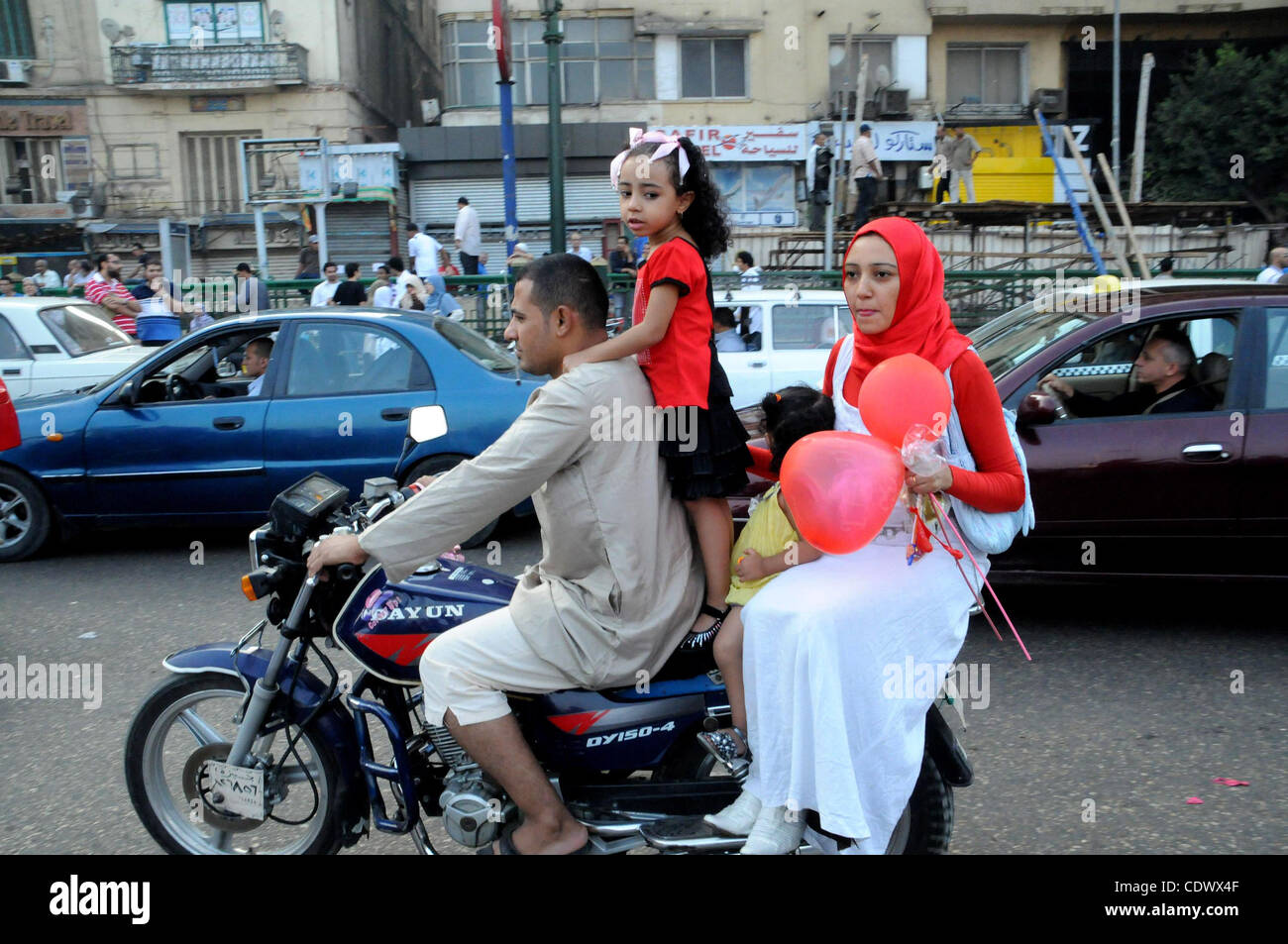 Aug. 30, 2011 - Cairo, Egypt - A man rides with his family a motorcycle ...