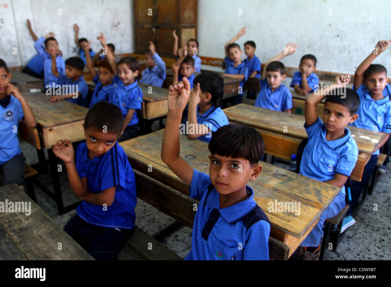 Palestinian students return back to their school in the morning of the ...