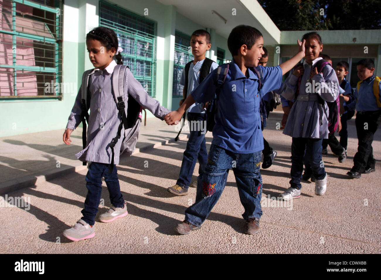 Palestinian students return back to their school in the morning of the ...