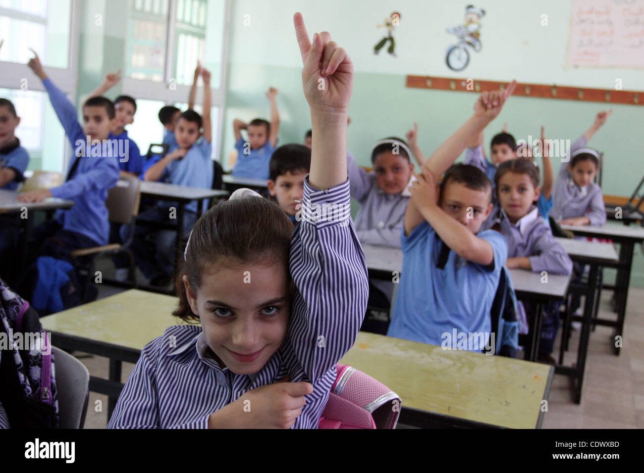 Palestinian students return back to their school in the morning of the ...
