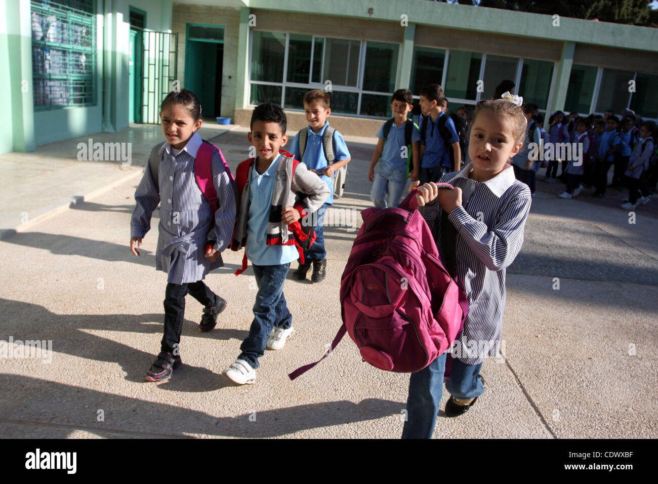 Palestinian students return back to their school in the morning of the ...