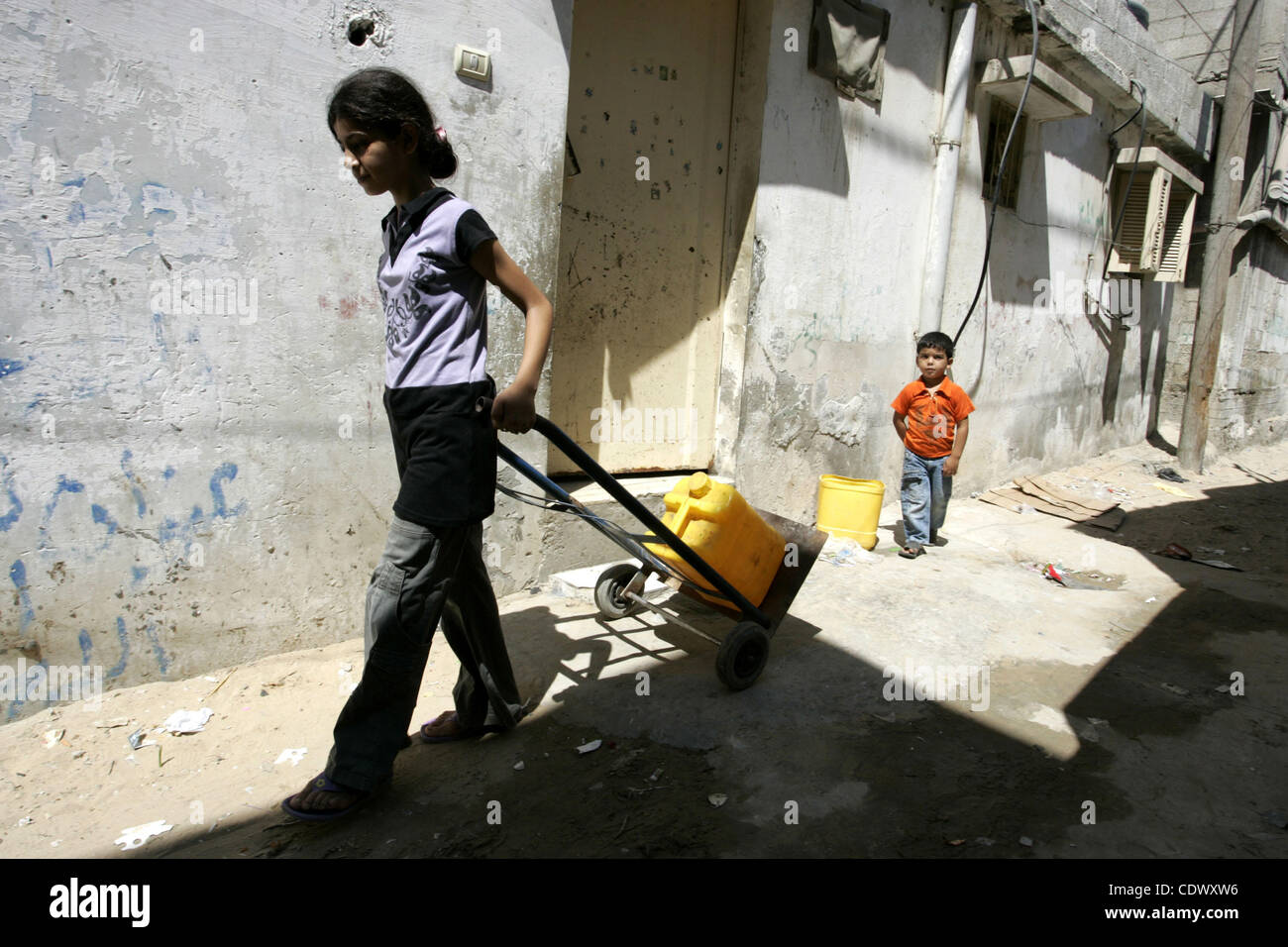 Palestinian children walk at the street in the Rafah Refugee Camp ...