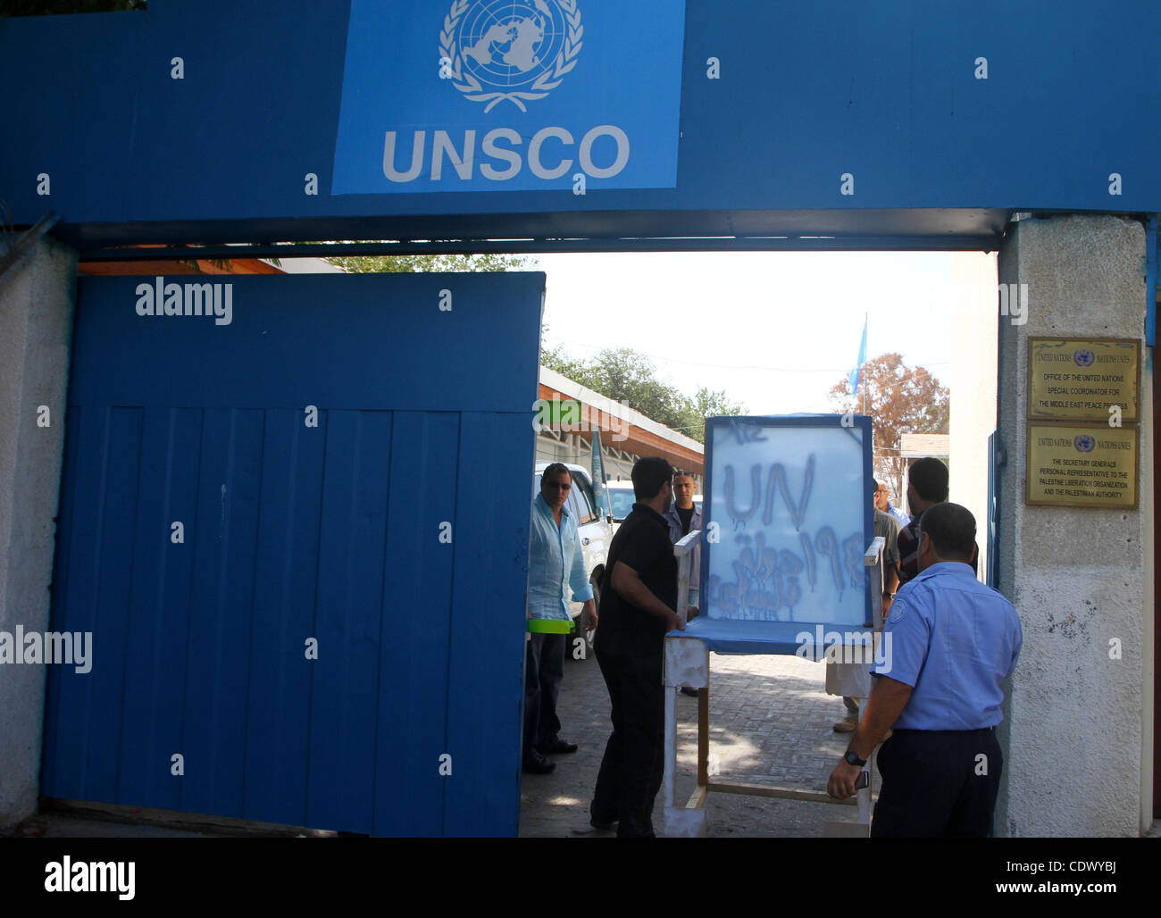 Palestinian carpenter Mustafa Masoud, 24, takes a chair symbolizing the ...