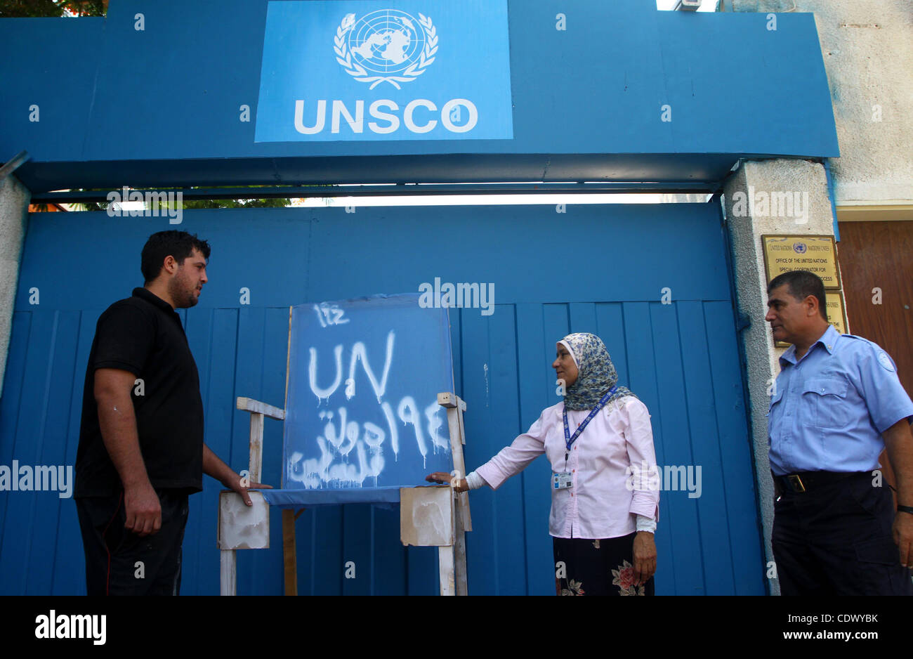 Palestinian carpenter Mustafa Masoud, 24, takes a chair symbolizing the ...