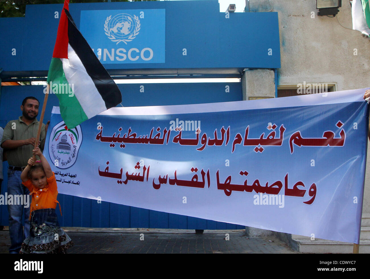 Palestinians hold posters during a demonstration in support of ...