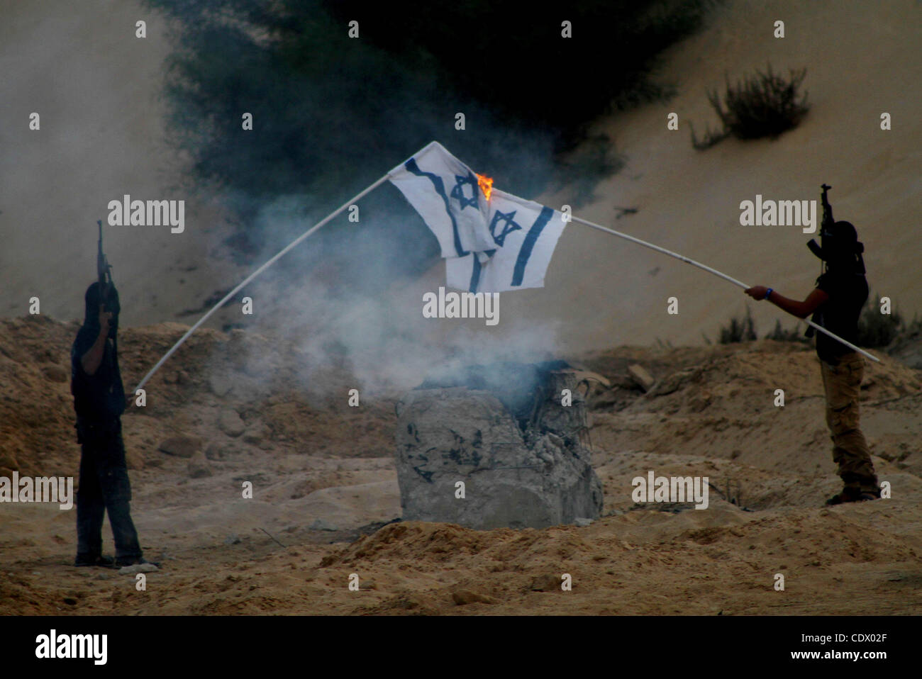 Palestinian militants from the Popular Resistance Movement participate ...