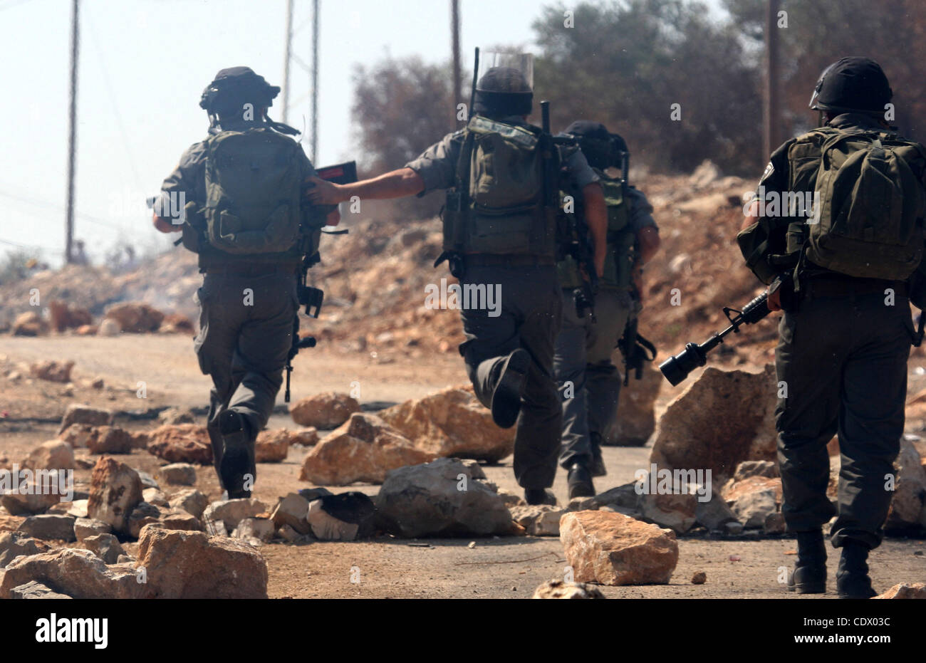 Israeli soldiers clash with Palestinian stone throwers on September 30 ...
