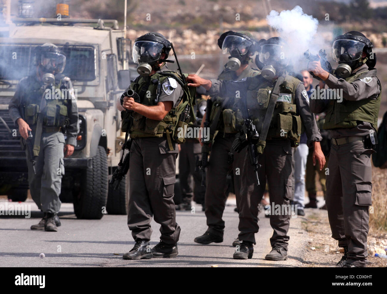 Israeli soldiers fire tear gas canister to disperse Palestinian stone ...