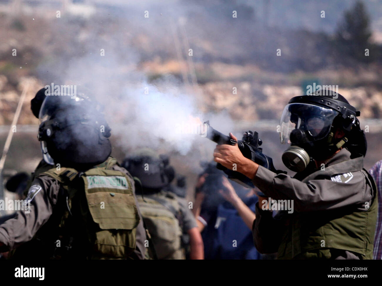 Israeli soldiers fire tear gas canister to disperse Palestinian stone ...