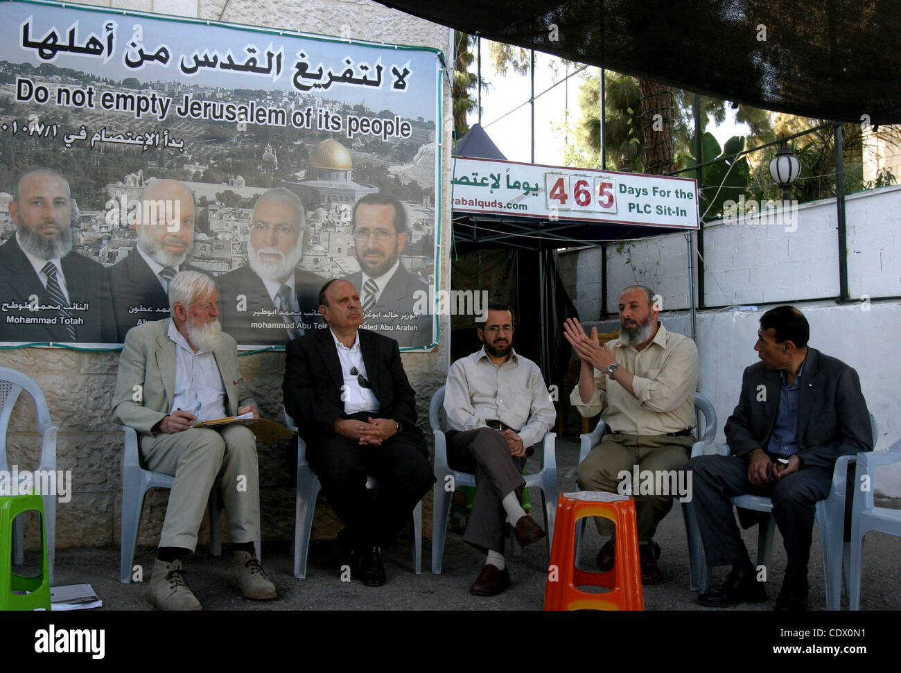 Palestinians and foreigners sit at the Red Cross compound in east ...