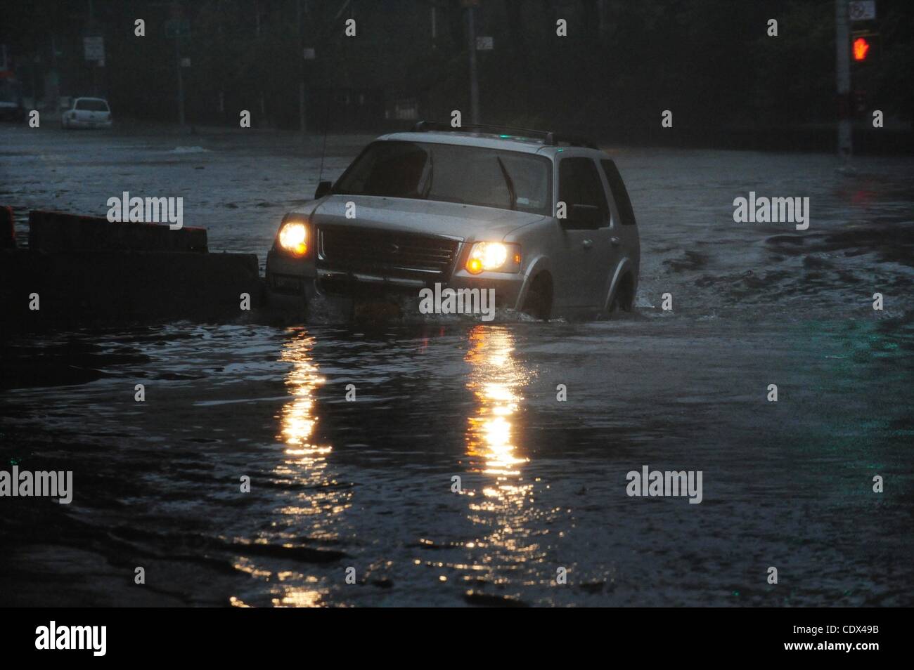 Aug. 28, 2011 - Manhattan, New York, U.S. - An SUV struggles through a ...