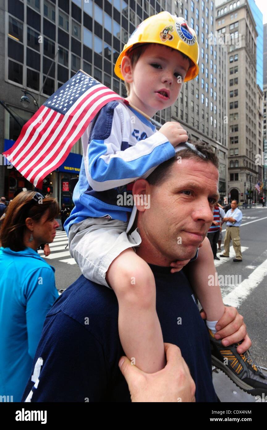 Sept. 10, 2011 - Manhattan, New York, U.S. - John Ormiston with his son ...