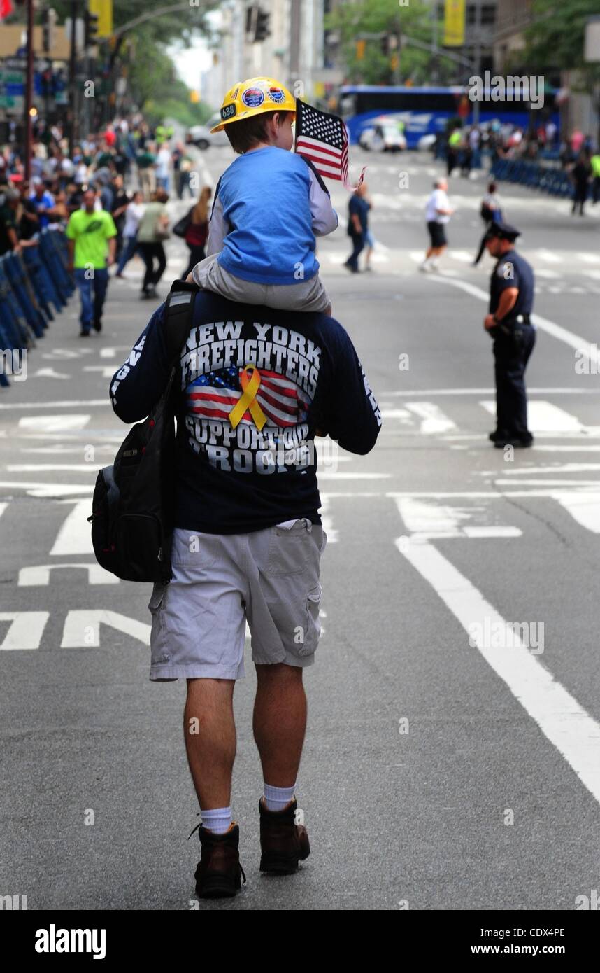Sept. 10, 2011 - Manhattan, New York, U.S. - John Ormiston with his son ...