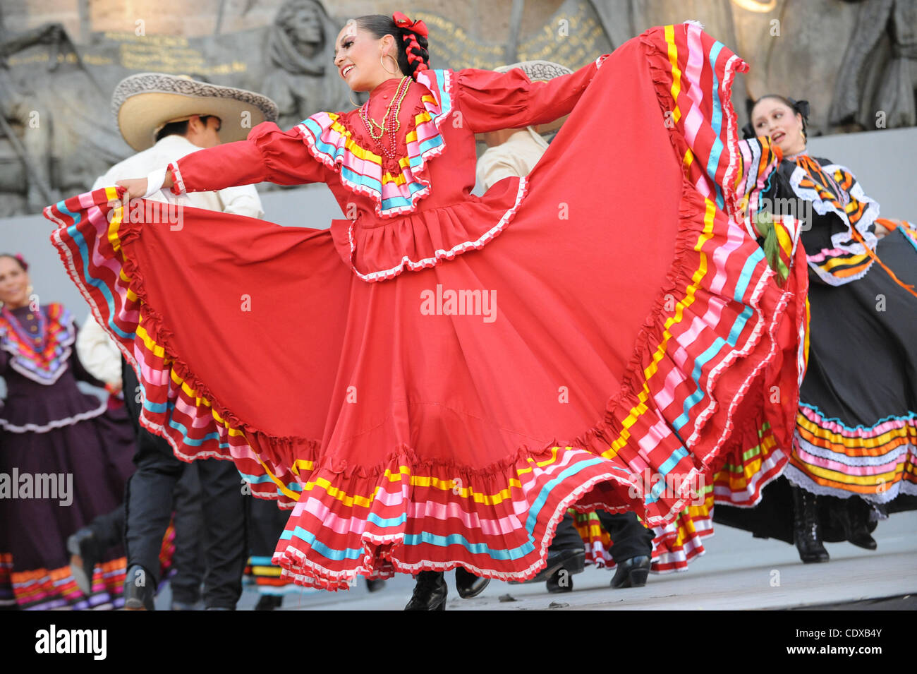 Ballet folklorico dancers perform onstage at Plaza Fundadores in ...