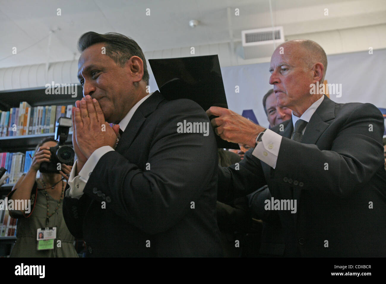 California Gov. Jerry Brown uses Assemblyman Gilbert Cedillo's back to ...