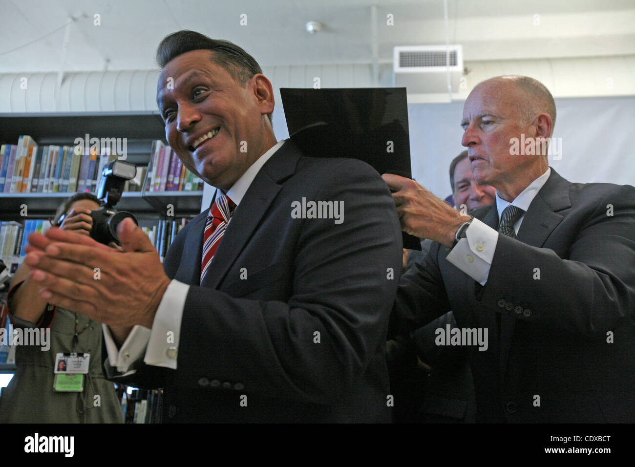 California Gov. Jerry Brown uses Assemblyman Gilbert Cedillo's back to ...