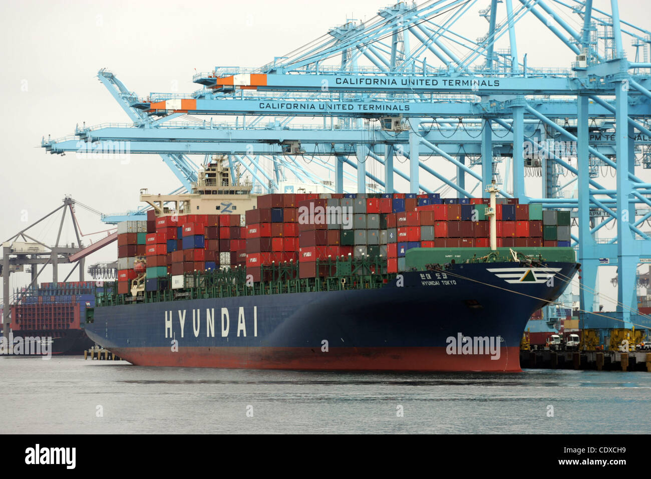 A Hyundai container ship waits to be unloaded at the Port of Los ...