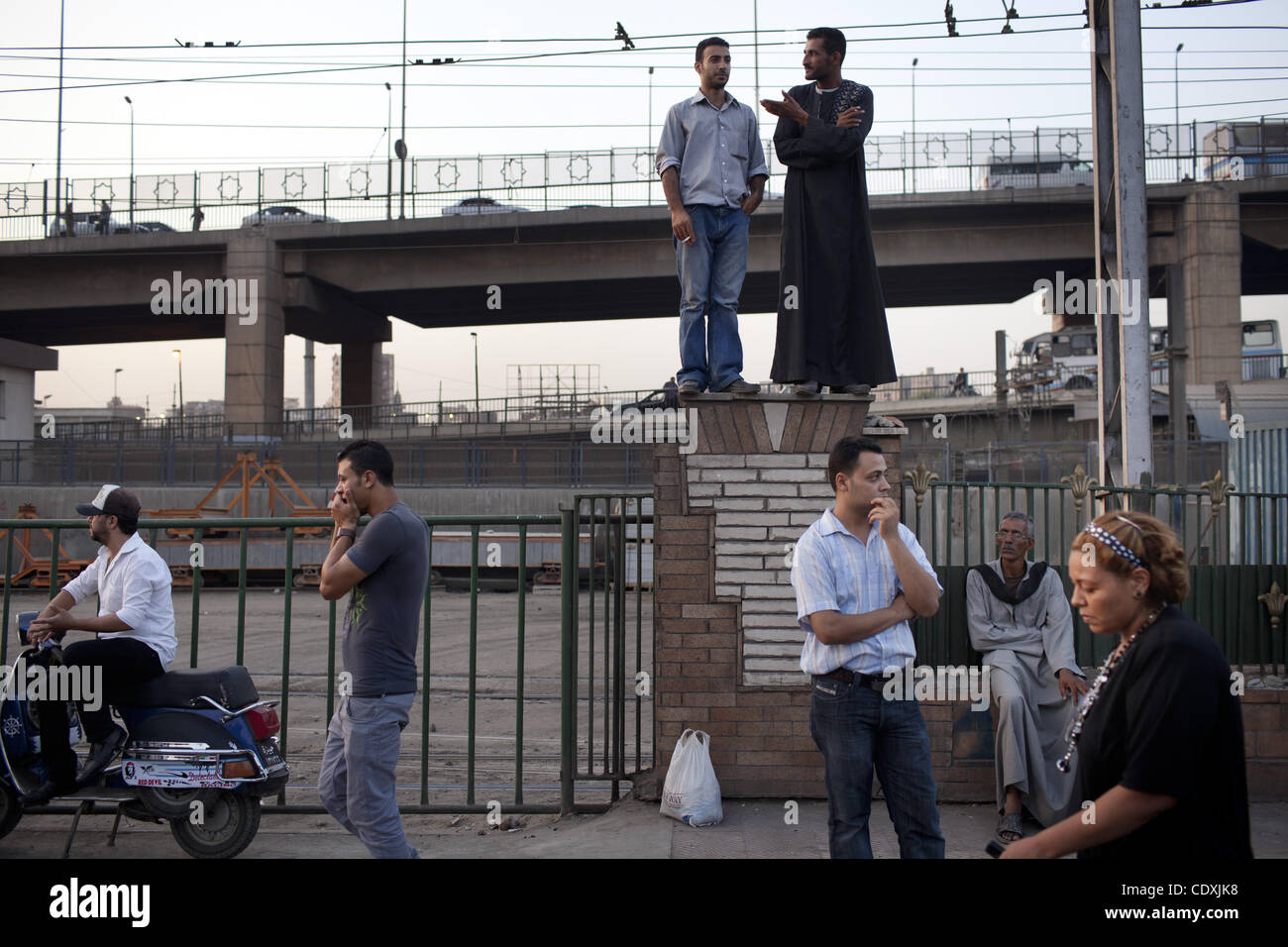 Oct. 10, 2011 - Cairo, Egypt - On top of the wall a muslim man from ...