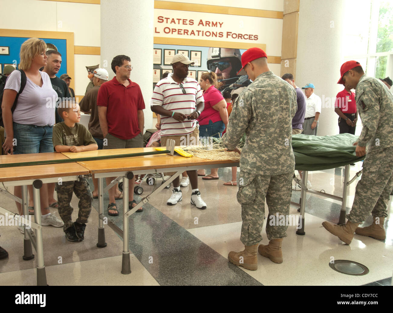 U.S. Army Parachute Riggers give visitors a parachute packing ...