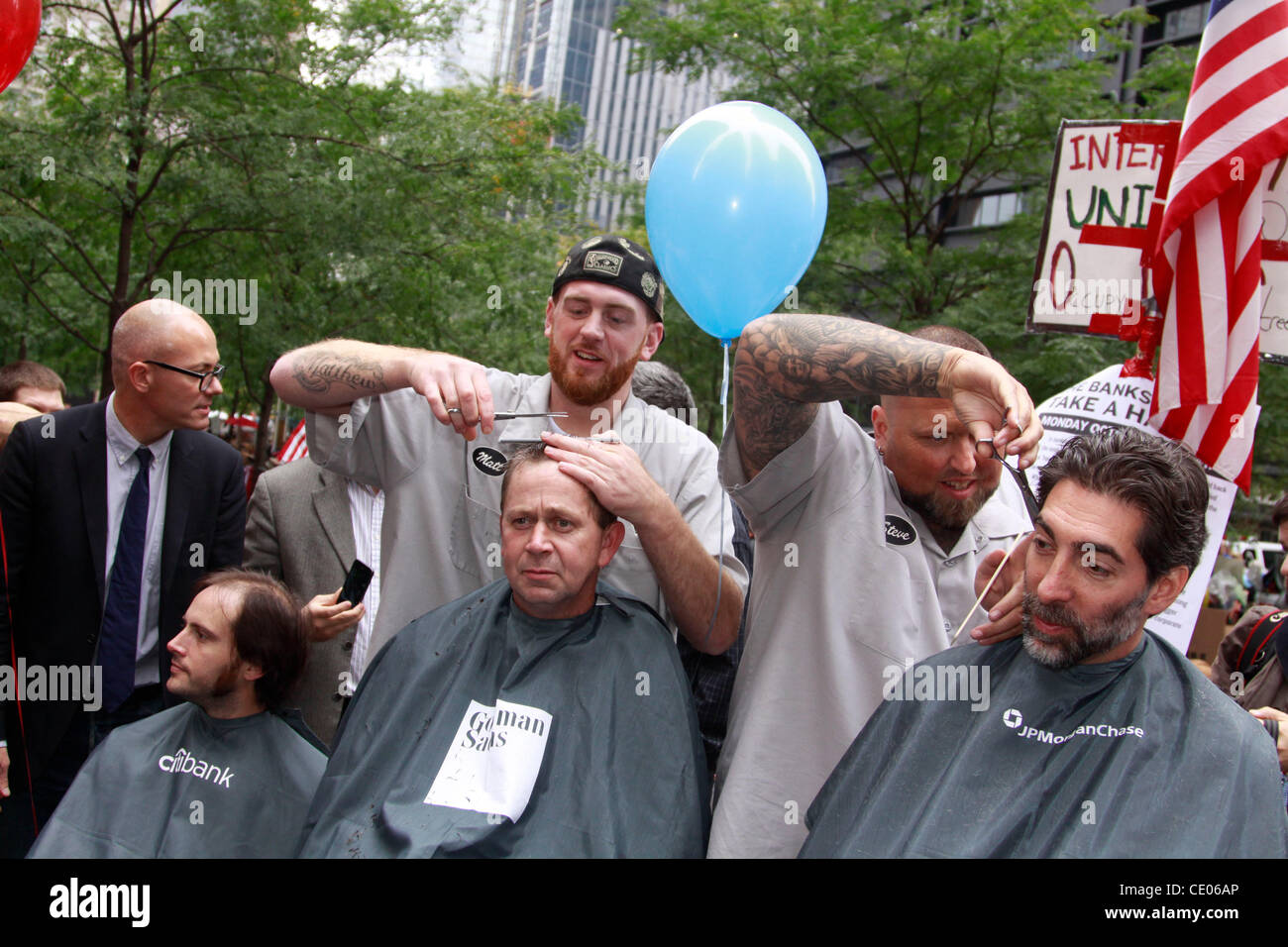 Symbolic haircuts at the Occupy Wall Street protest in Zuccotti Park ...