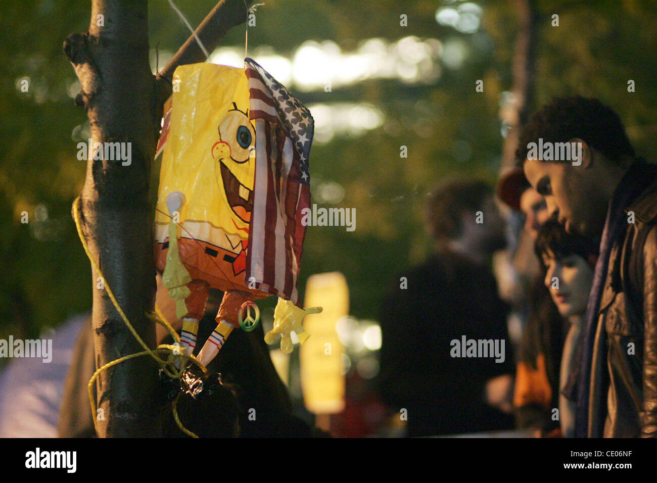 Spongebob Squarepants hangs from a tree at the Occupy Wall Street ...