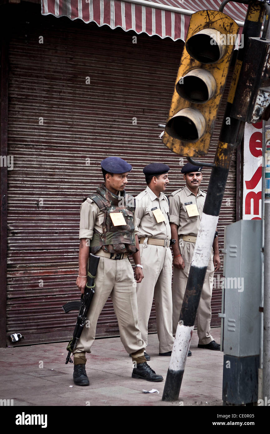 Indian paramilitary soldier and police stand guard at a check point in ...