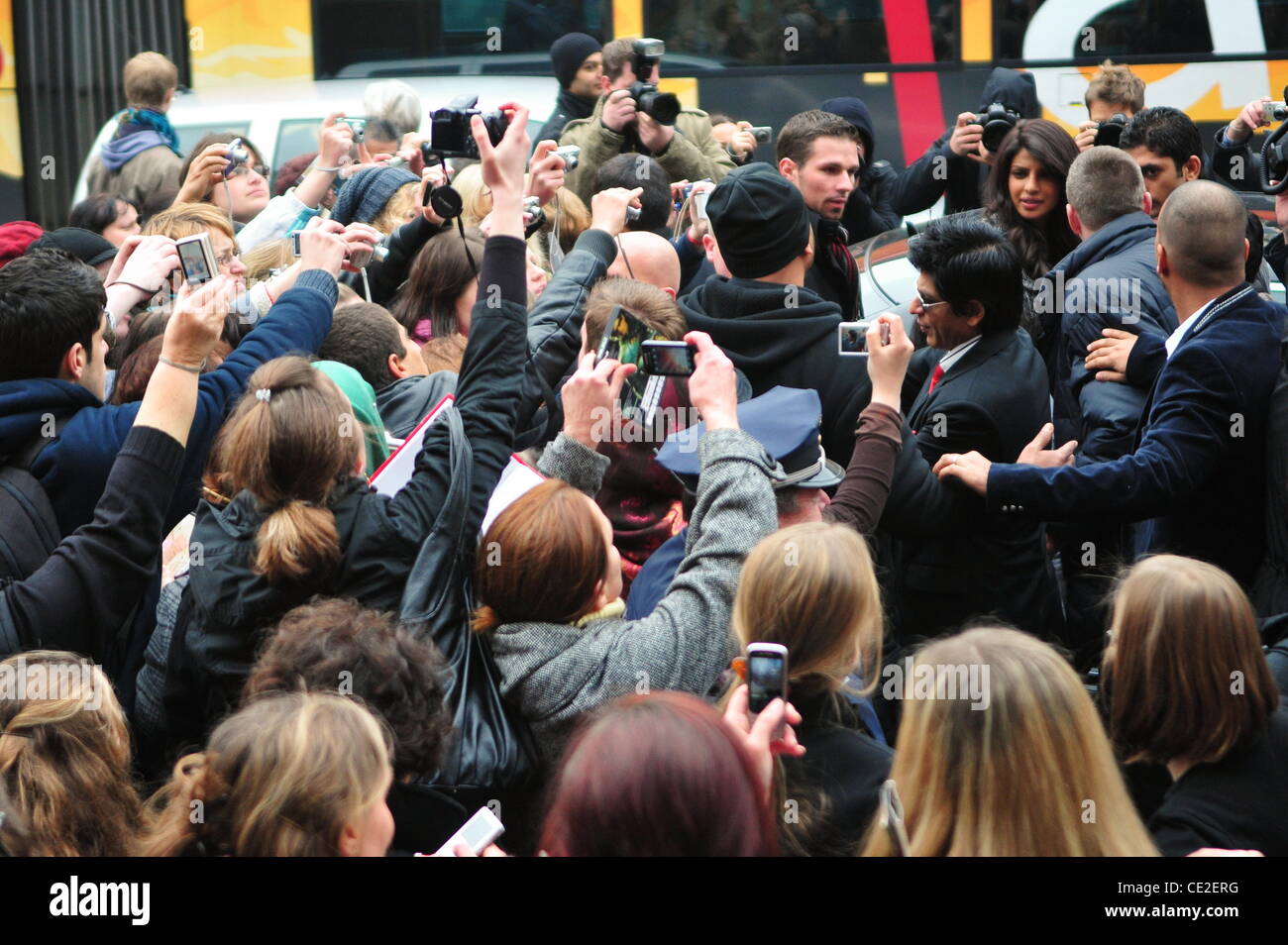 Shahrukh Khan trying to find a way through the crowd whilst leaving the ...