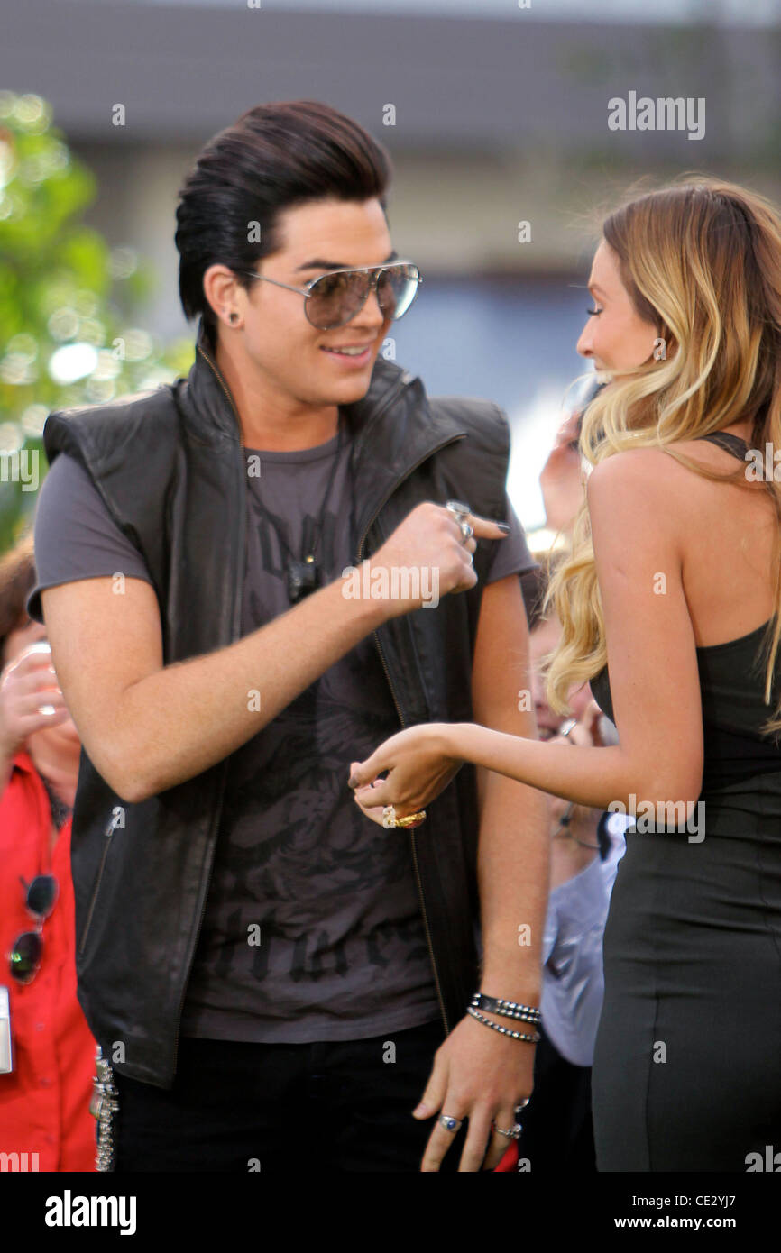 Adam Lambert filming an interview for entertainment television news ...