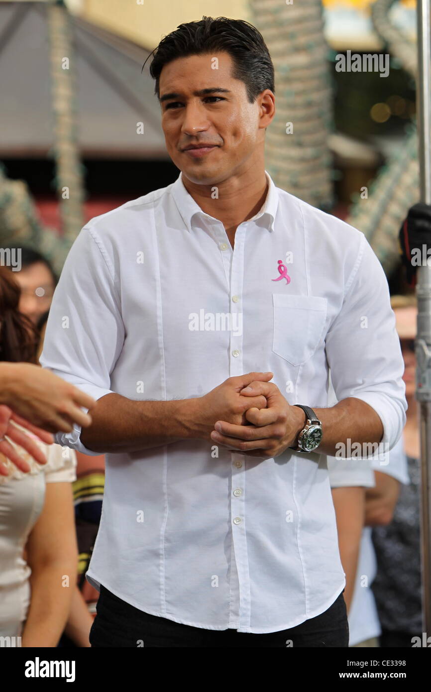 Mario Lopez filming an interview for the entertainment television news ...