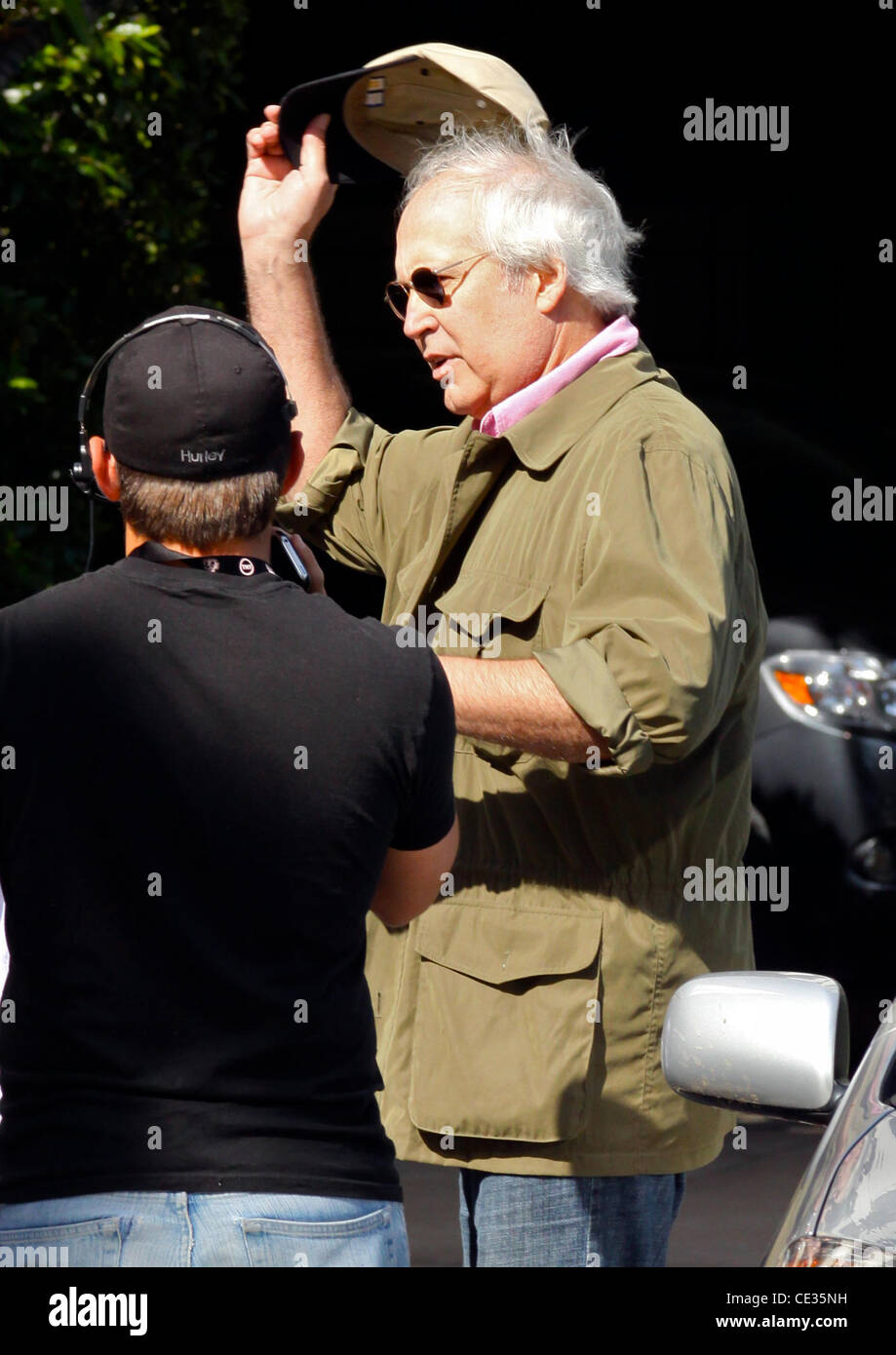 Chevy Chase filming an interview for the entertainment television news ...