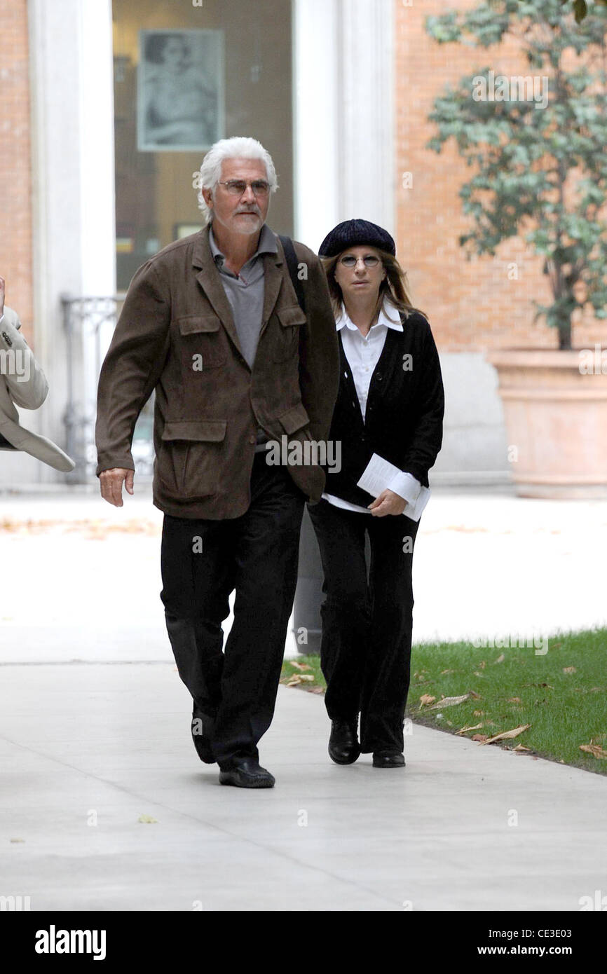 James Brolin and Barbra Streisand holding hands as they leave an office ...