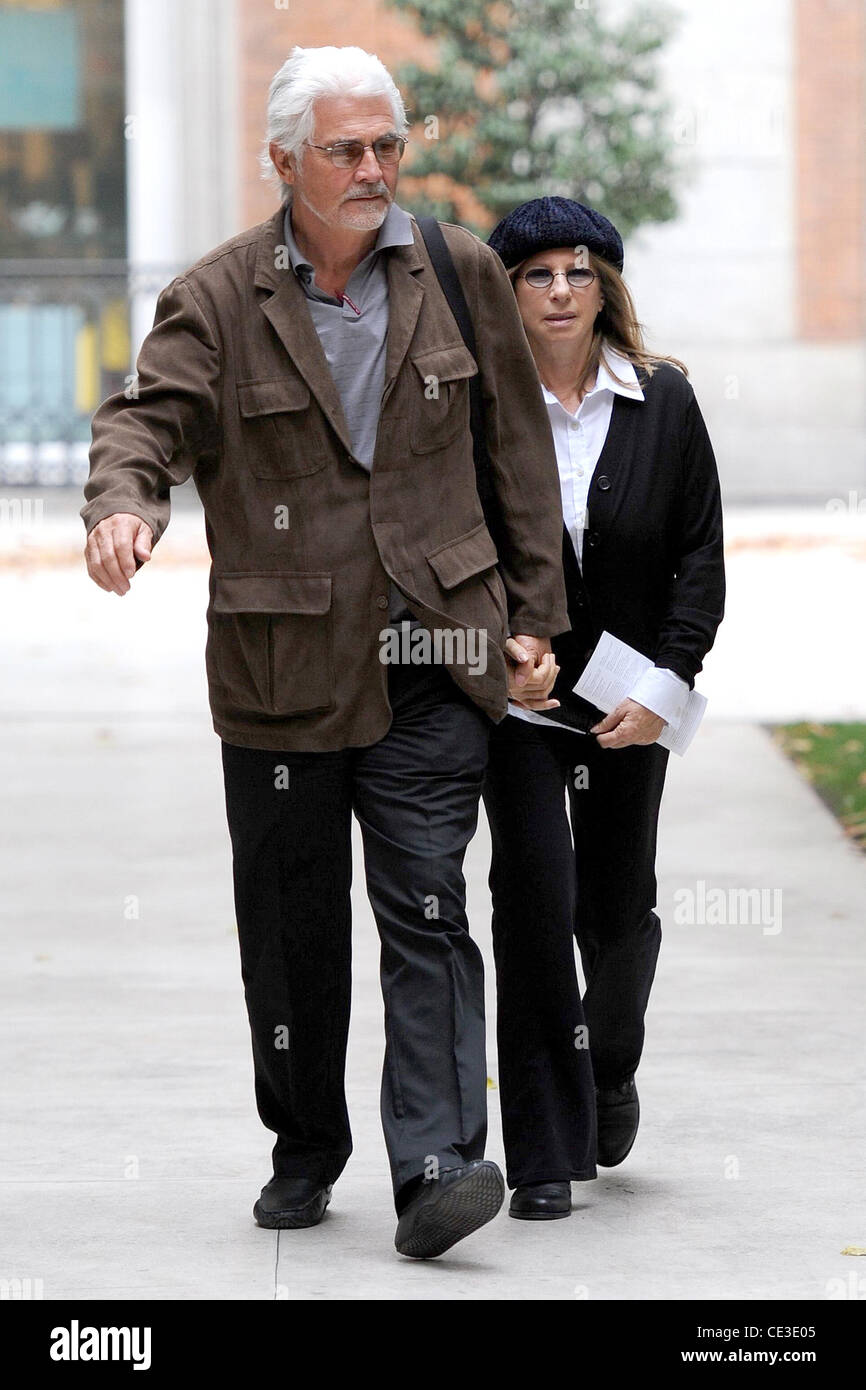 James Brolin and Barbra Streisand holding hands as they leave an office ...