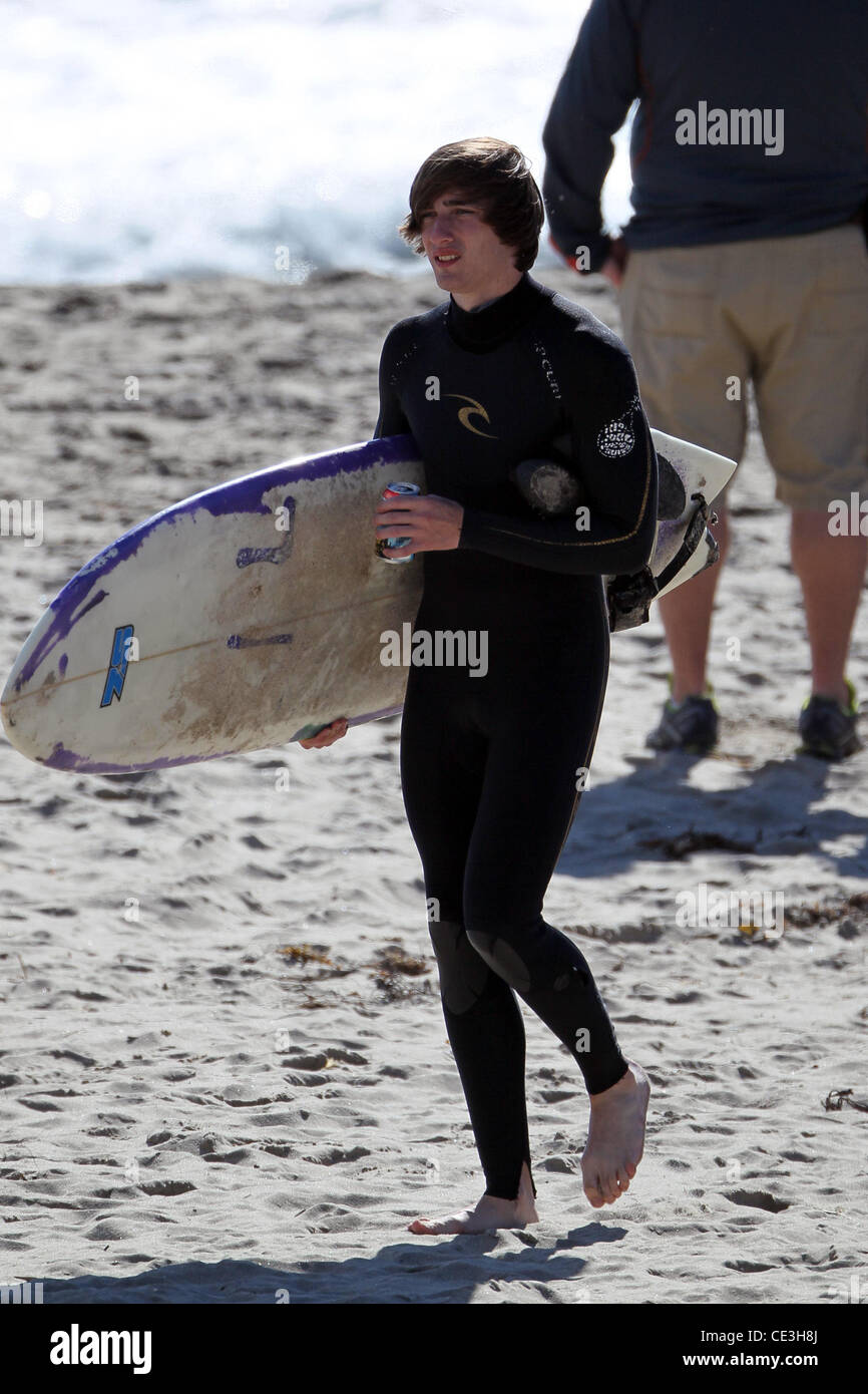 Cast members of the television show '90210' film a beach scene with ...