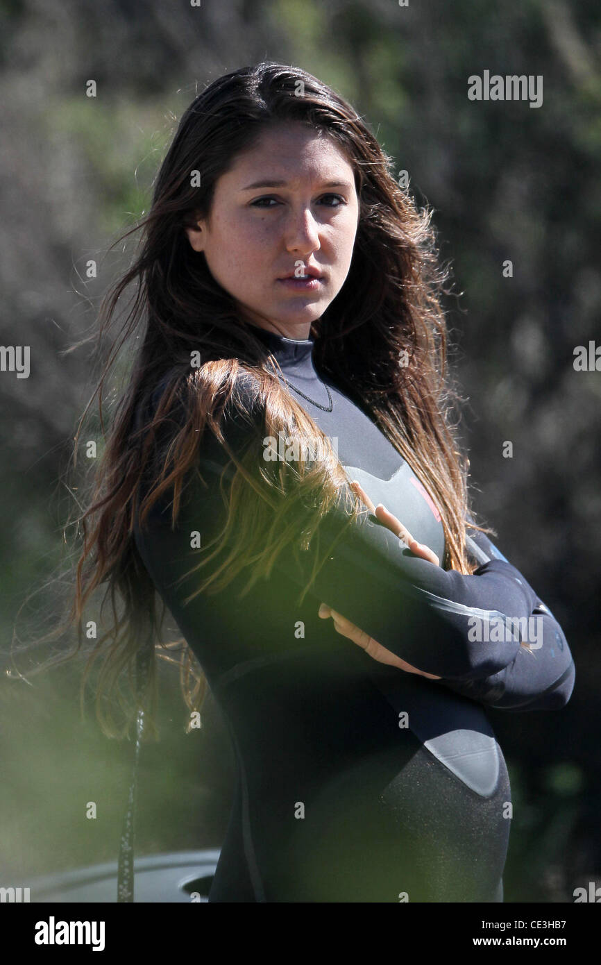 Cast members of the television show '90210' film a beach scene with ...