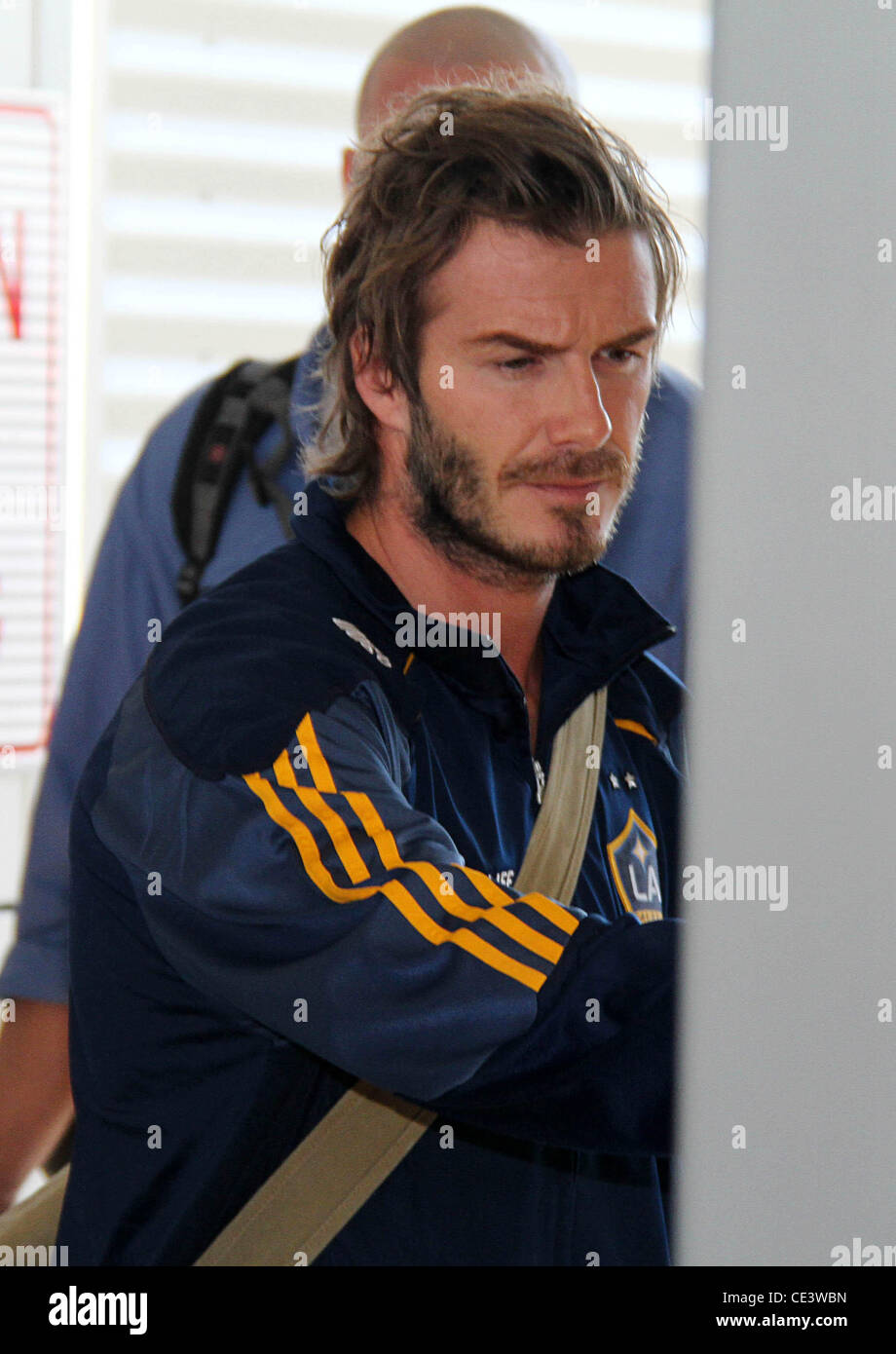 David Beckham is greeted by fans as he arrives at Sydney International ...