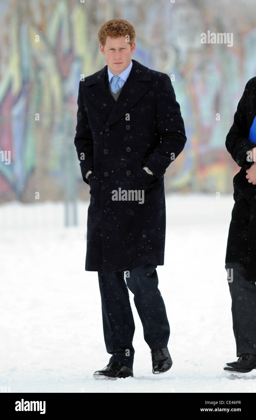 Prince Harry walks through the snow as he visits the Bernauer Strasse ...