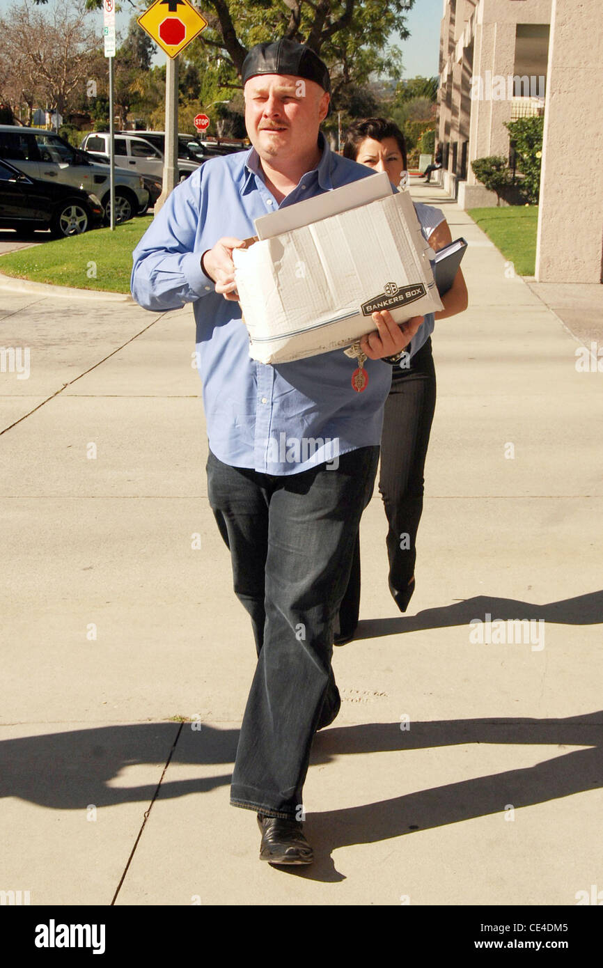 Howard Mann arriving at his lawyer's office carrying a box. Katherine ...