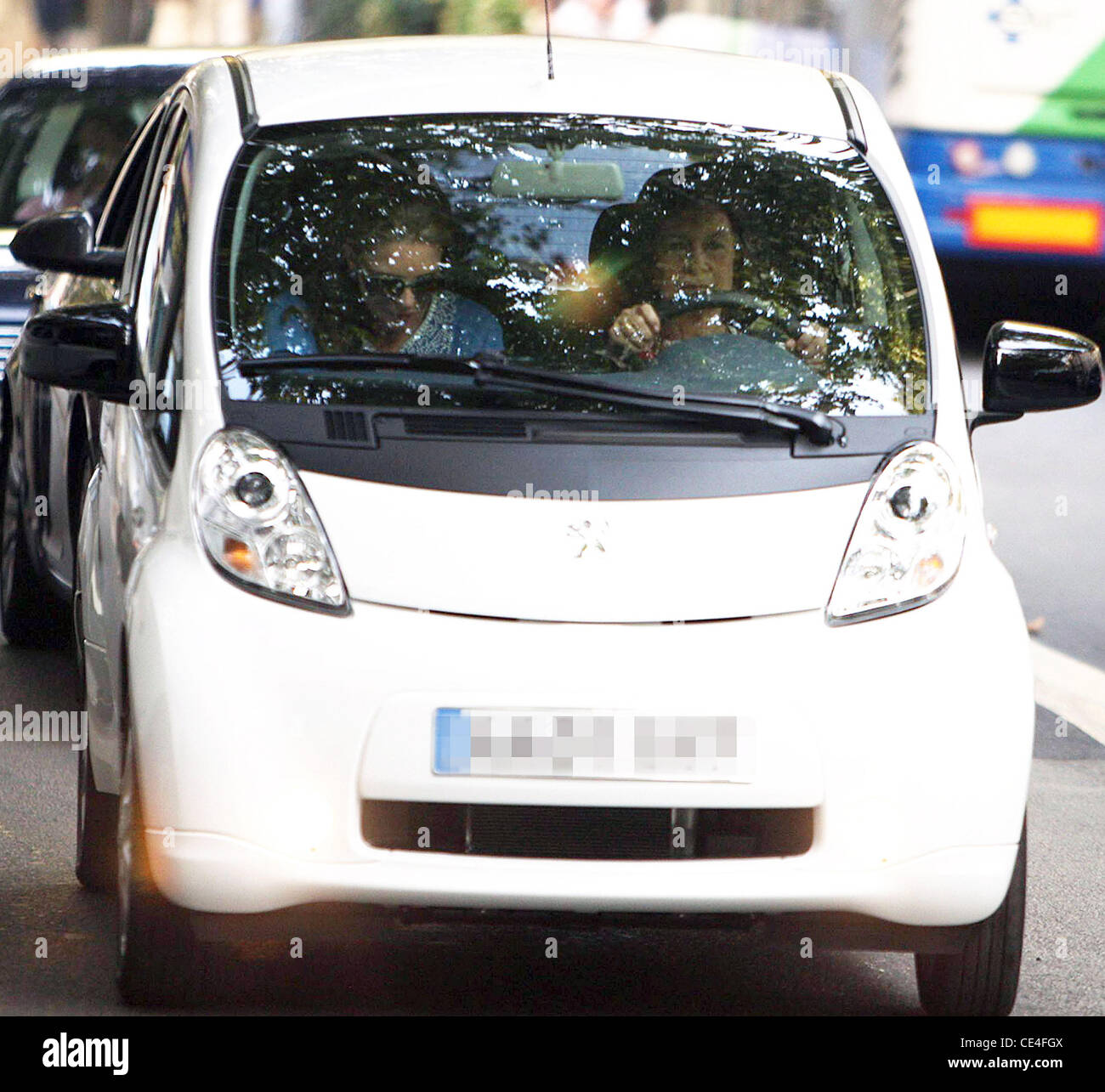 Queen Sofia of Spain drives her Mini Cooper car while Queen Noor of ...