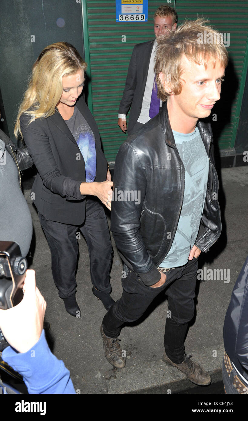 Kate Hudson and Dominic Howard of the rock band Muse, outside the Ivy ...
