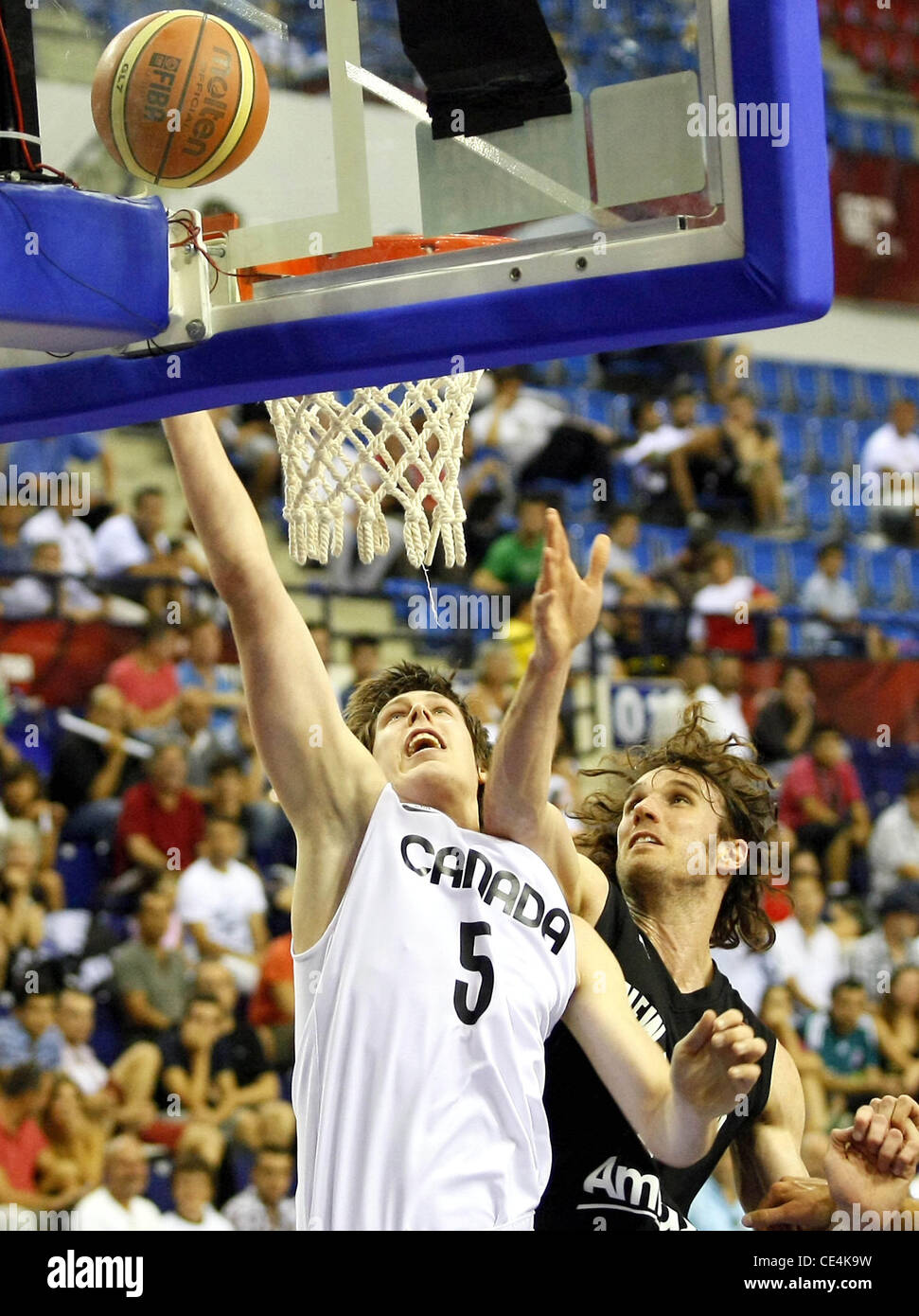 Kelly Olynyk of Canada and Casey Frank of New Zealand. 2010 FIBA World ...