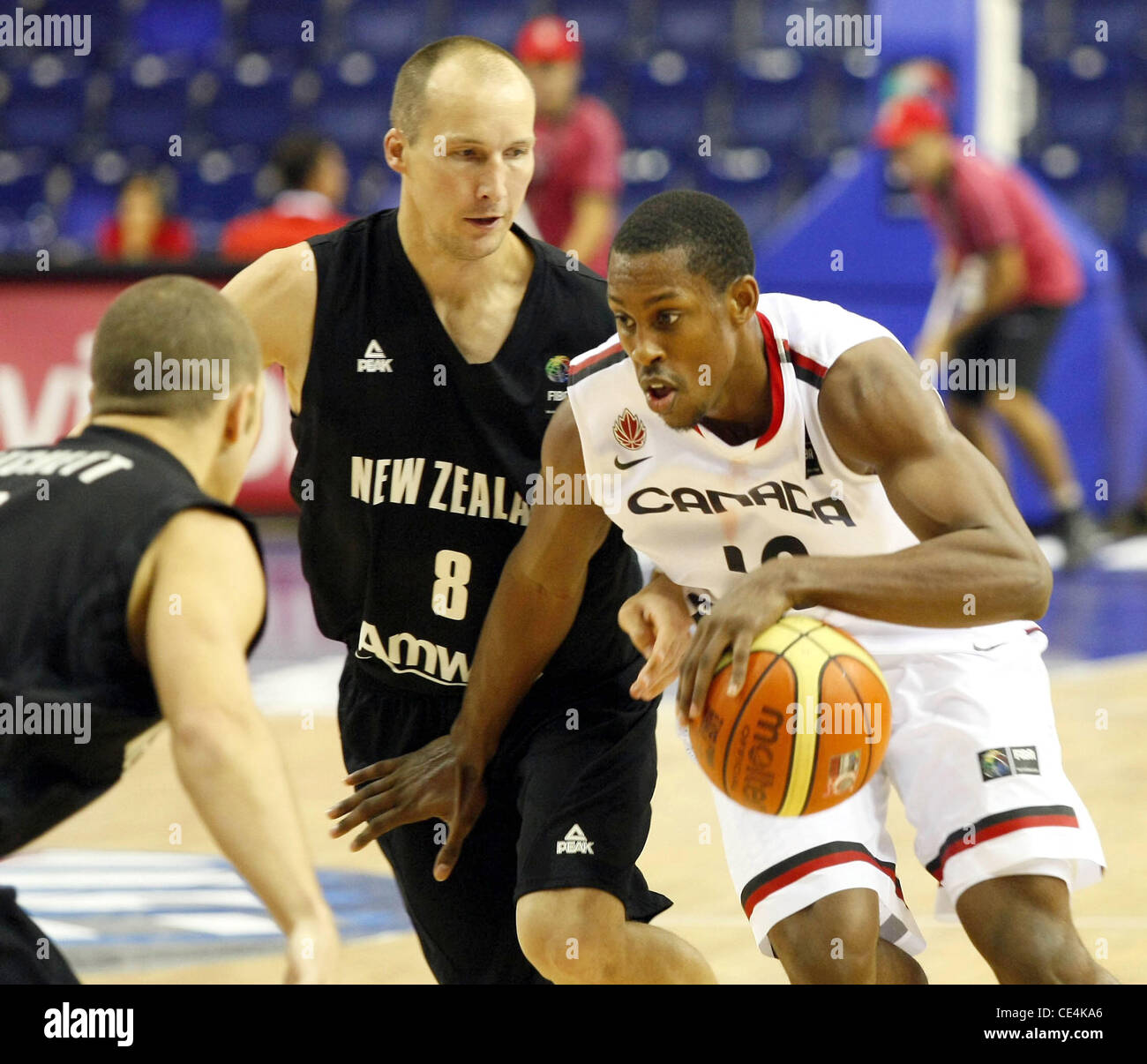 Phill Jones of New Zealand and Robert Sacre of Canada. 2010 FIBA World ...