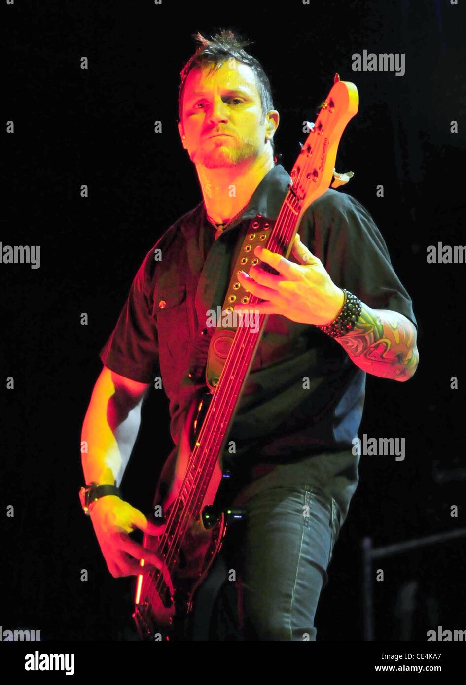Bass guitarist Brian Marshall of rock band Creed performs on stage ...
