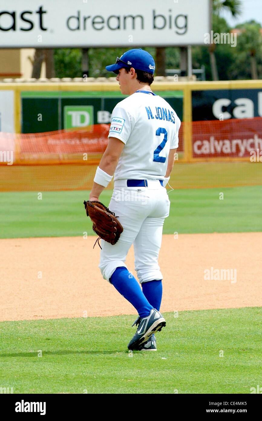 Nick Jonas Jonas Brothers participates in a softball game to encourage ...