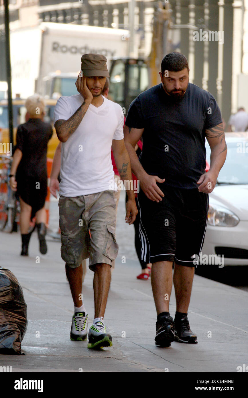 Swizz Beatz aka Kasseem Dean talking on his cell phone while walking to ...