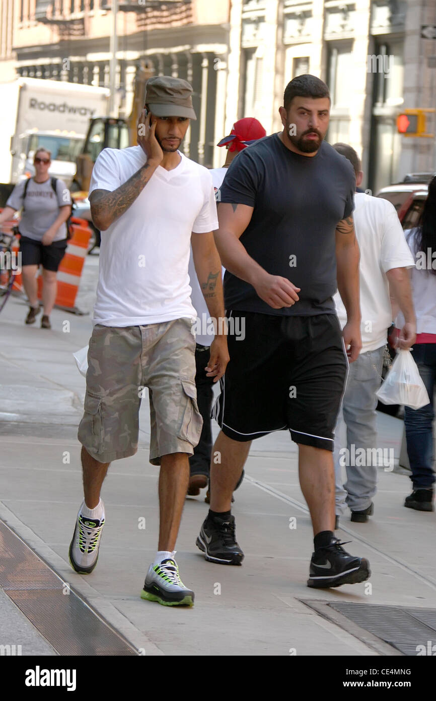 Swizz Beatz aka Kasseem Dean talking on his cell phone while walking to ...