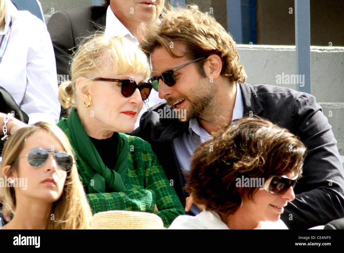 Guest and Bradley Cooper Celebrities watching the women's semifinals ...