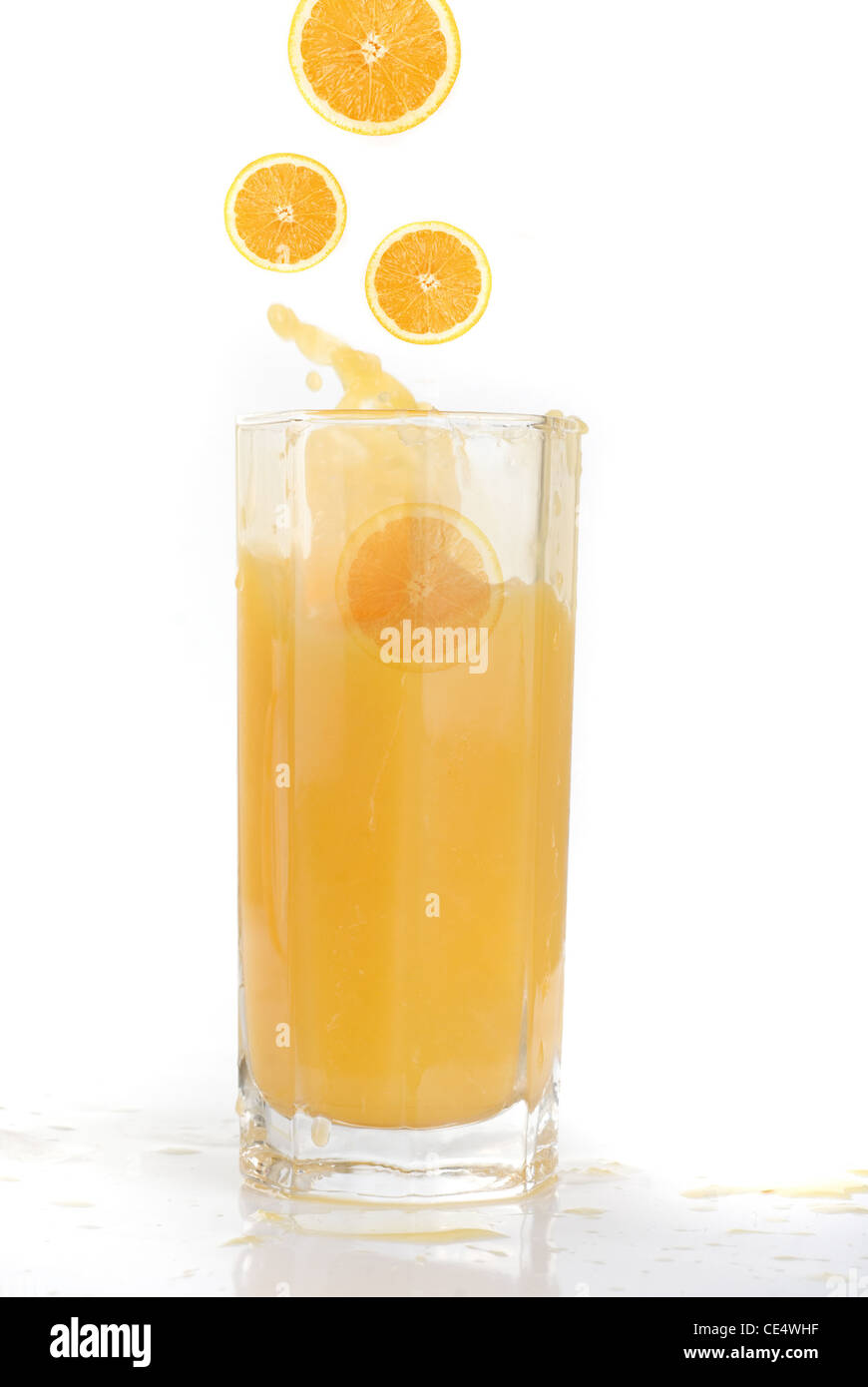 Fresh squeezed pouring citrus juice with fruits isolated on a white ...