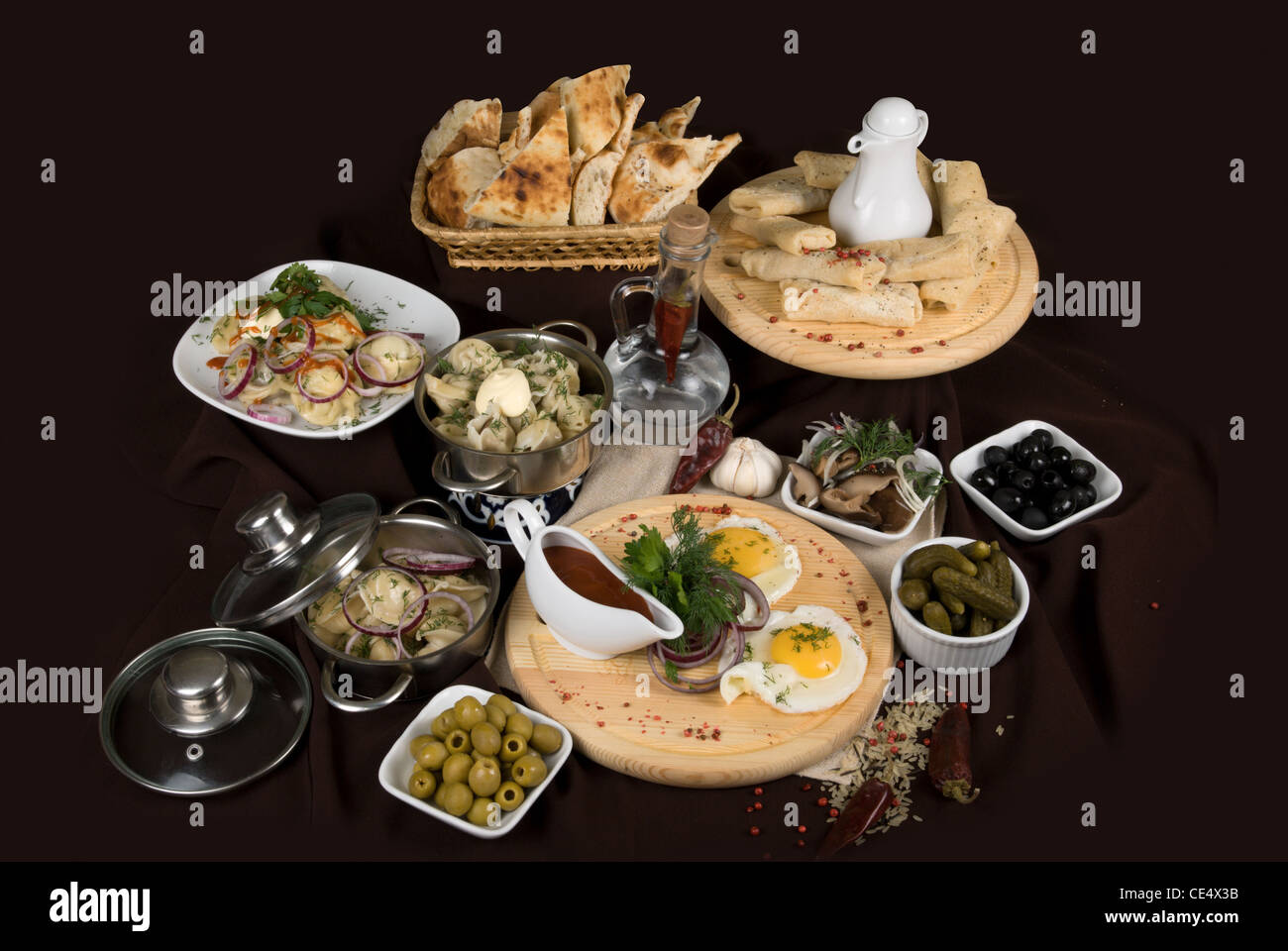 Many food dishes on the restaurant table. close up Stock Photo - Alamy