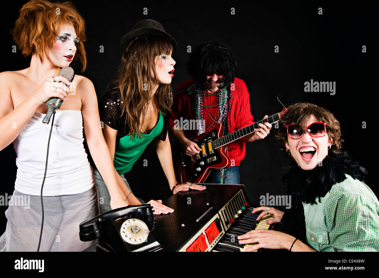 Music band of four youngsters performing Stock Photo - Alamy